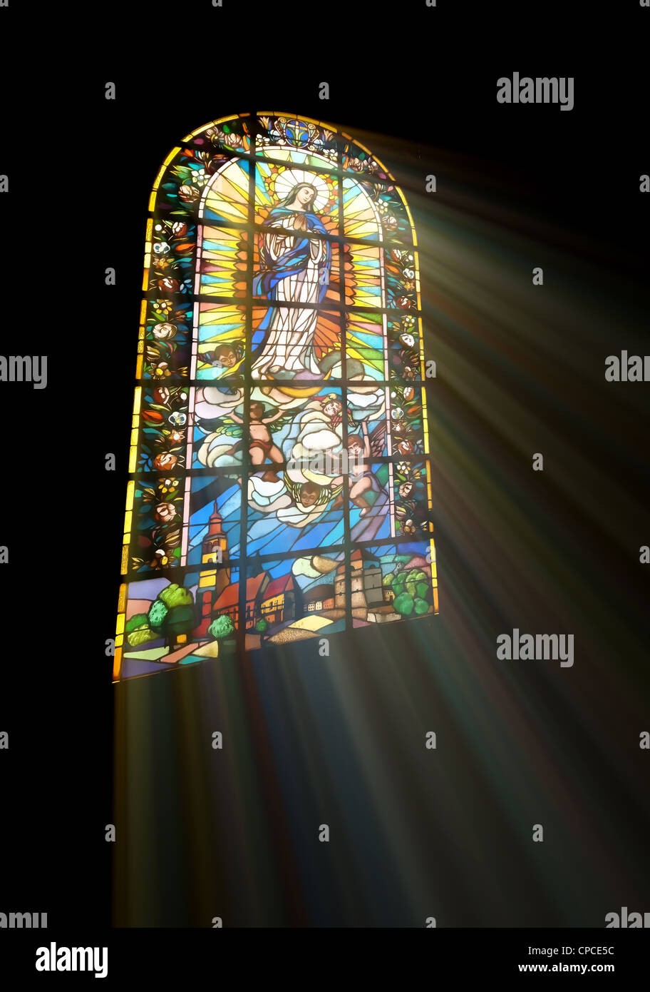 Biblical stained glass with rays of light shining through Stock Photo ...