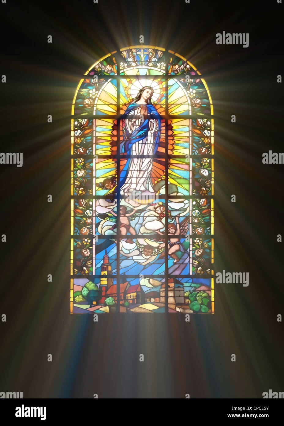 Biblical stained glass with rays of light shining through Stock Photo ...