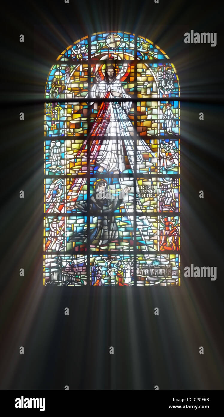 Biblical stained glass with rays of light shining through Stock Photo ...