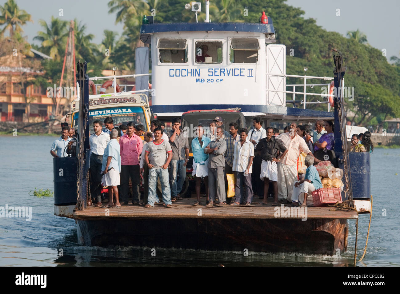 A packed Cochin ferry coming in to the quay at Fort Cochin in Kerala ...