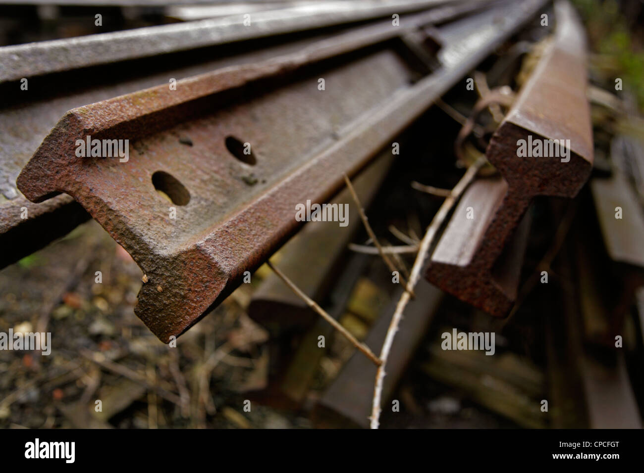 Lengths of old rusty railway lines in scrapyard Stock Photo - Alamy