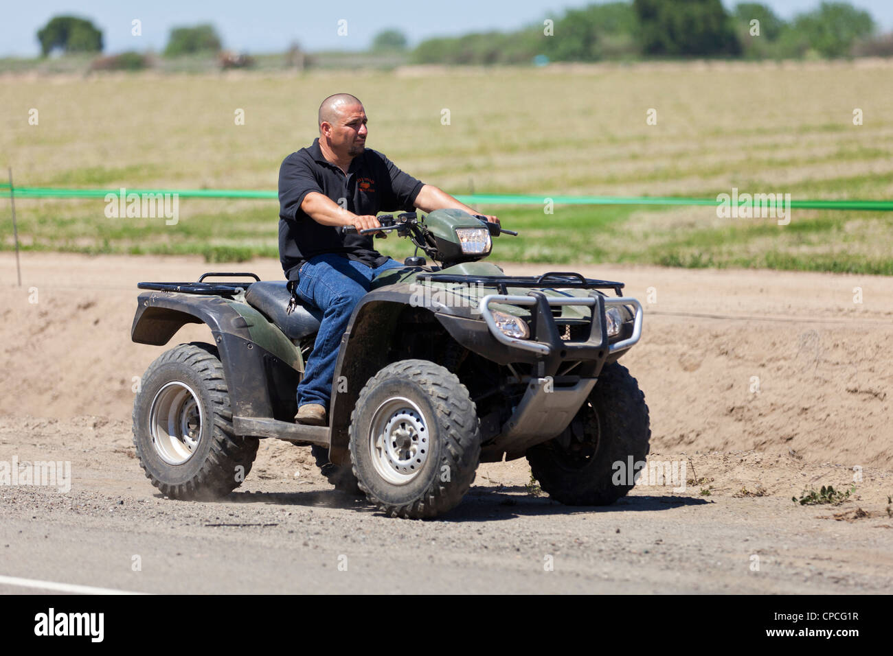 A man riding an ATV Stock Photo - Alamy