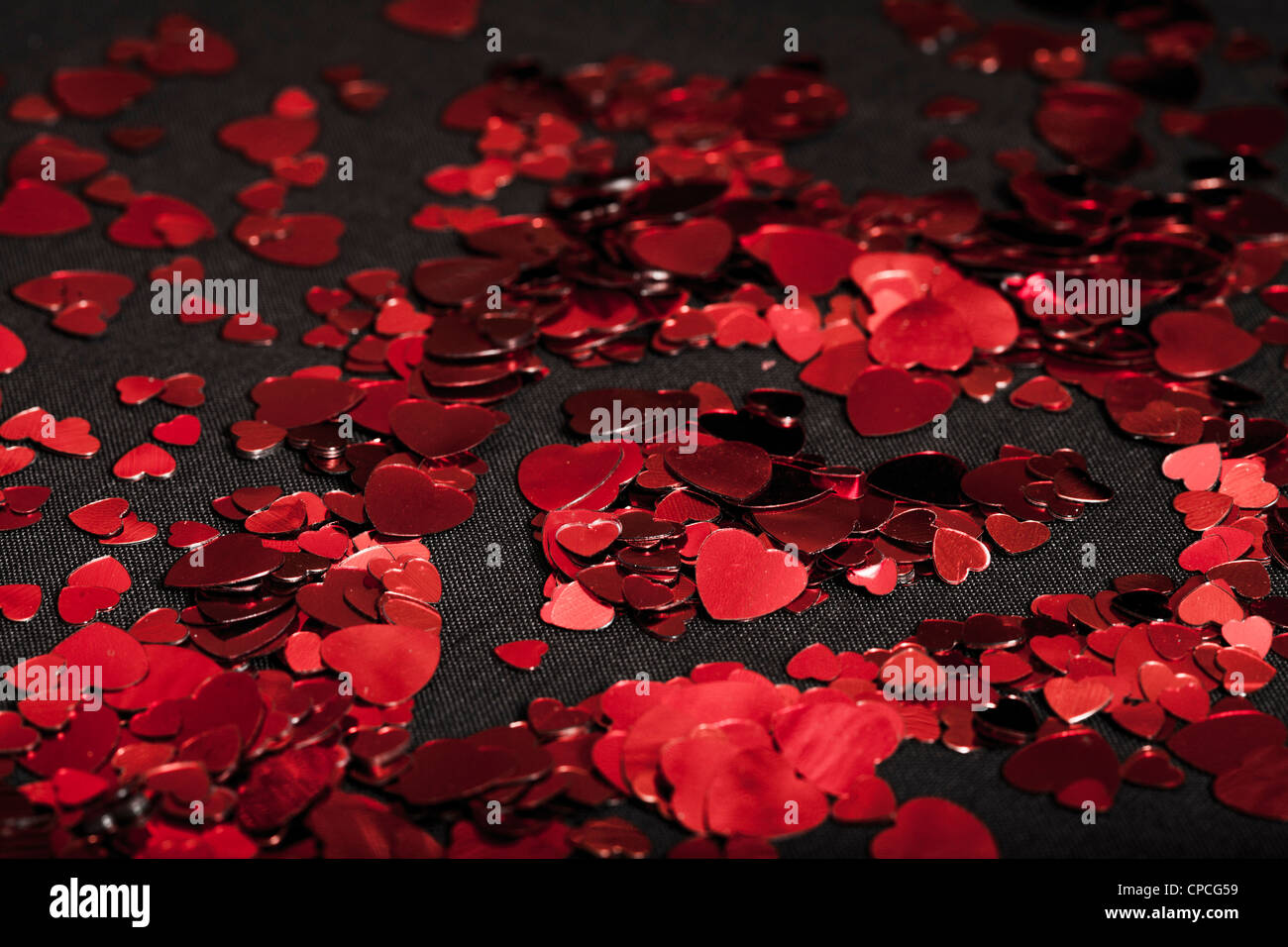 Decorative love hearts positioned to create a larger love heart, still ...