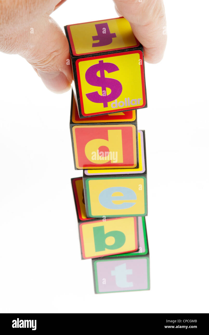 debt concept with toy buiding blocks Stock Photo - Alamy