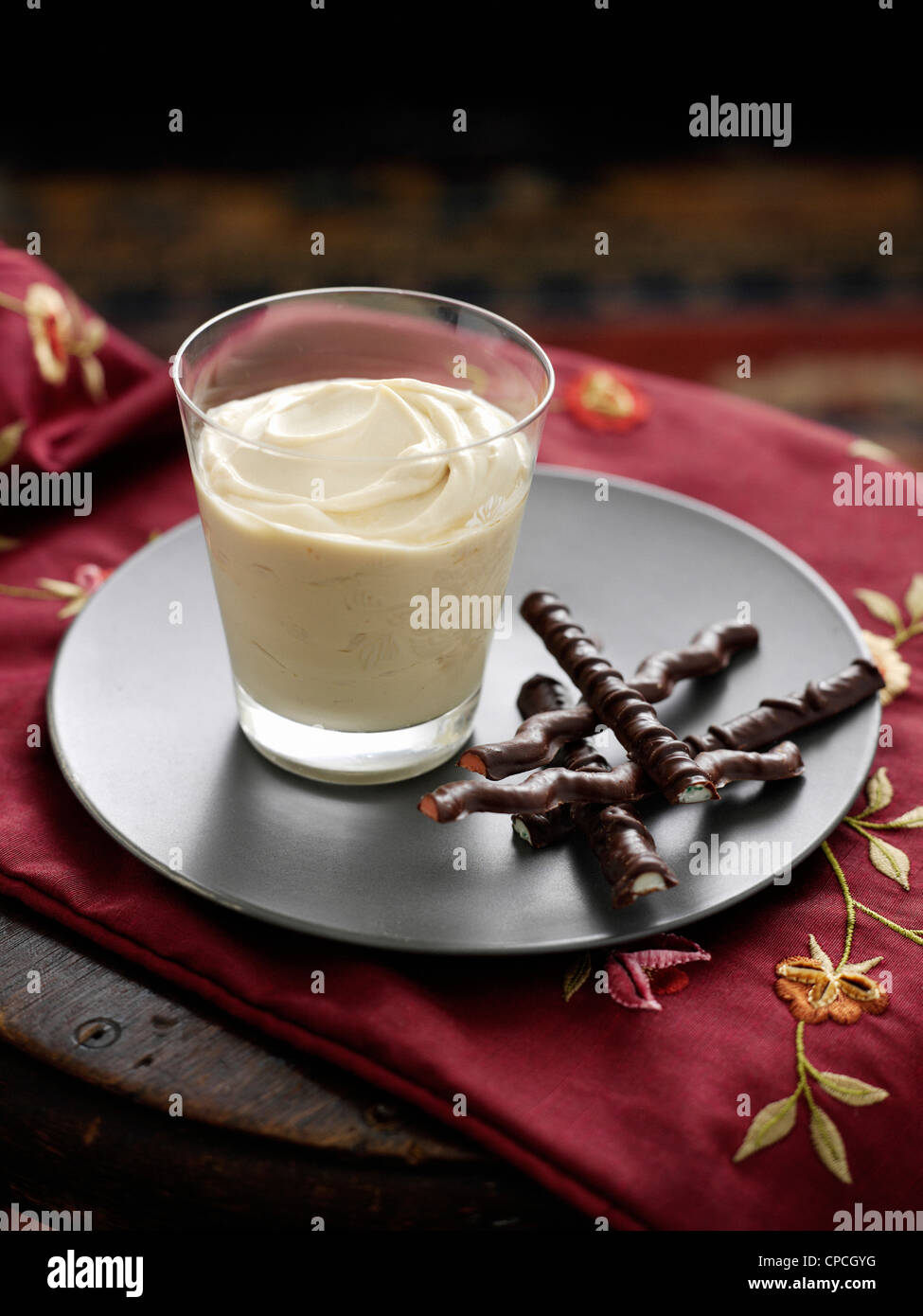 Glass of mousse with chocolates Stock Photo - Alamy