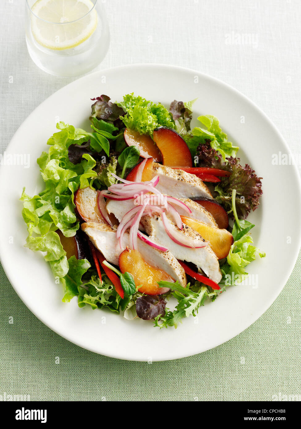 Plate of fish and plum salad Stock Photo - Alamy