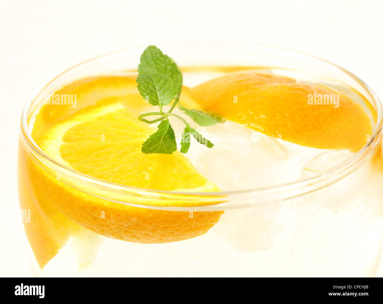fresh orange lemonade with mint leaves and ice Stock Photo - Alamy