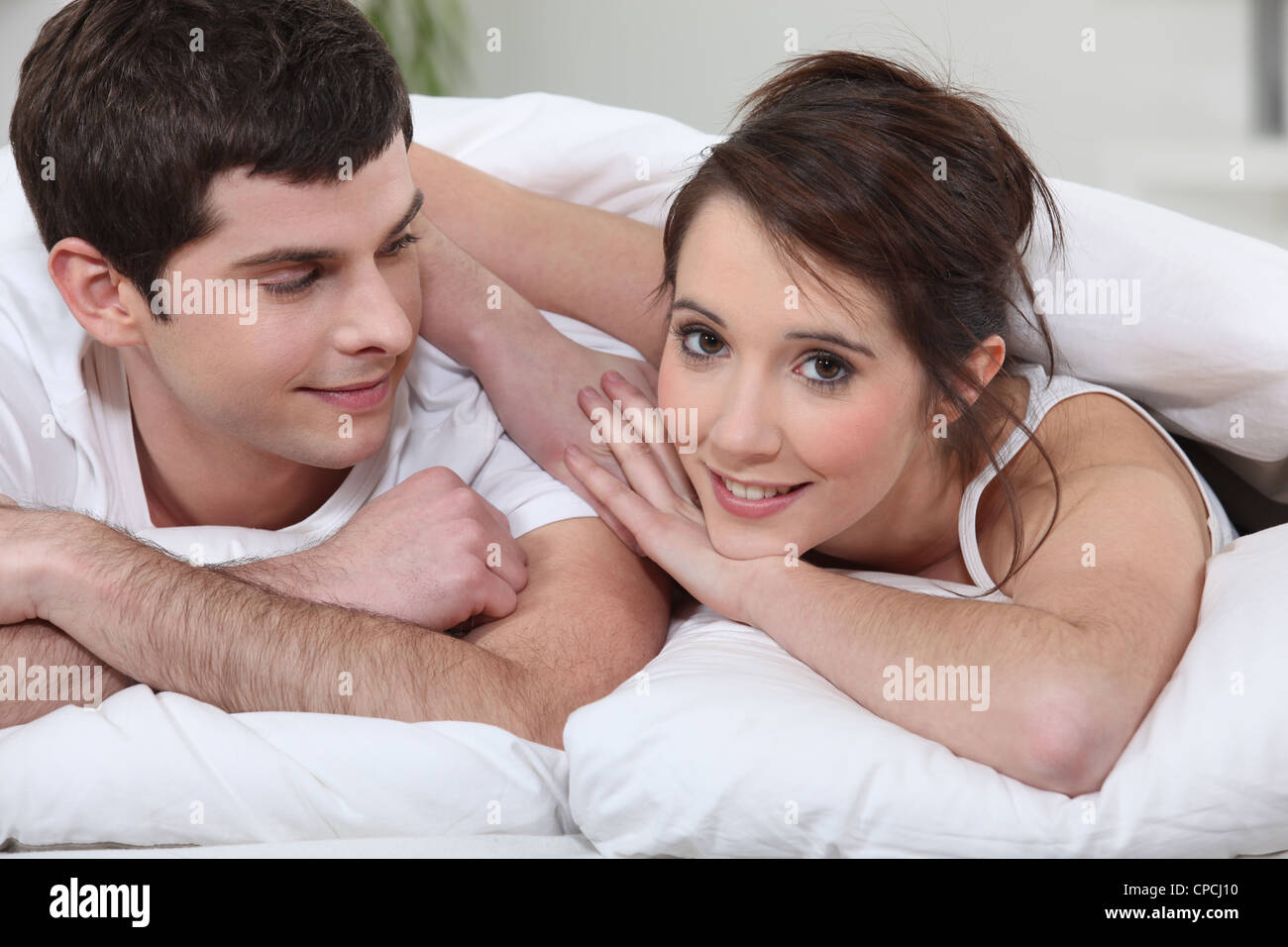 Young couple under covers hi-res stock photography and images - Alamy