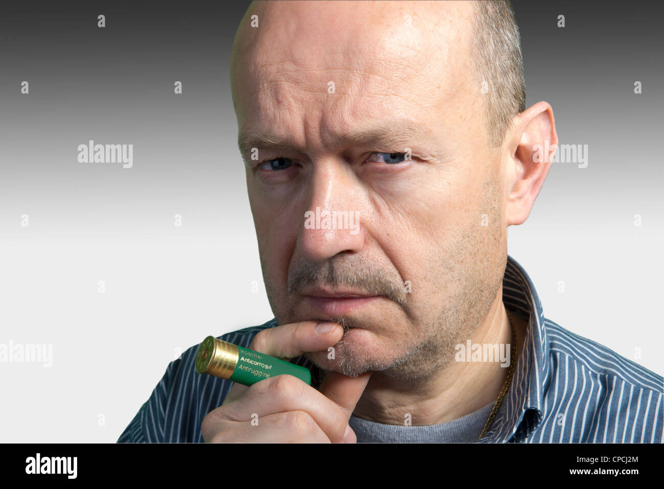 A man smoking a bullet Stock Photo - Alamy