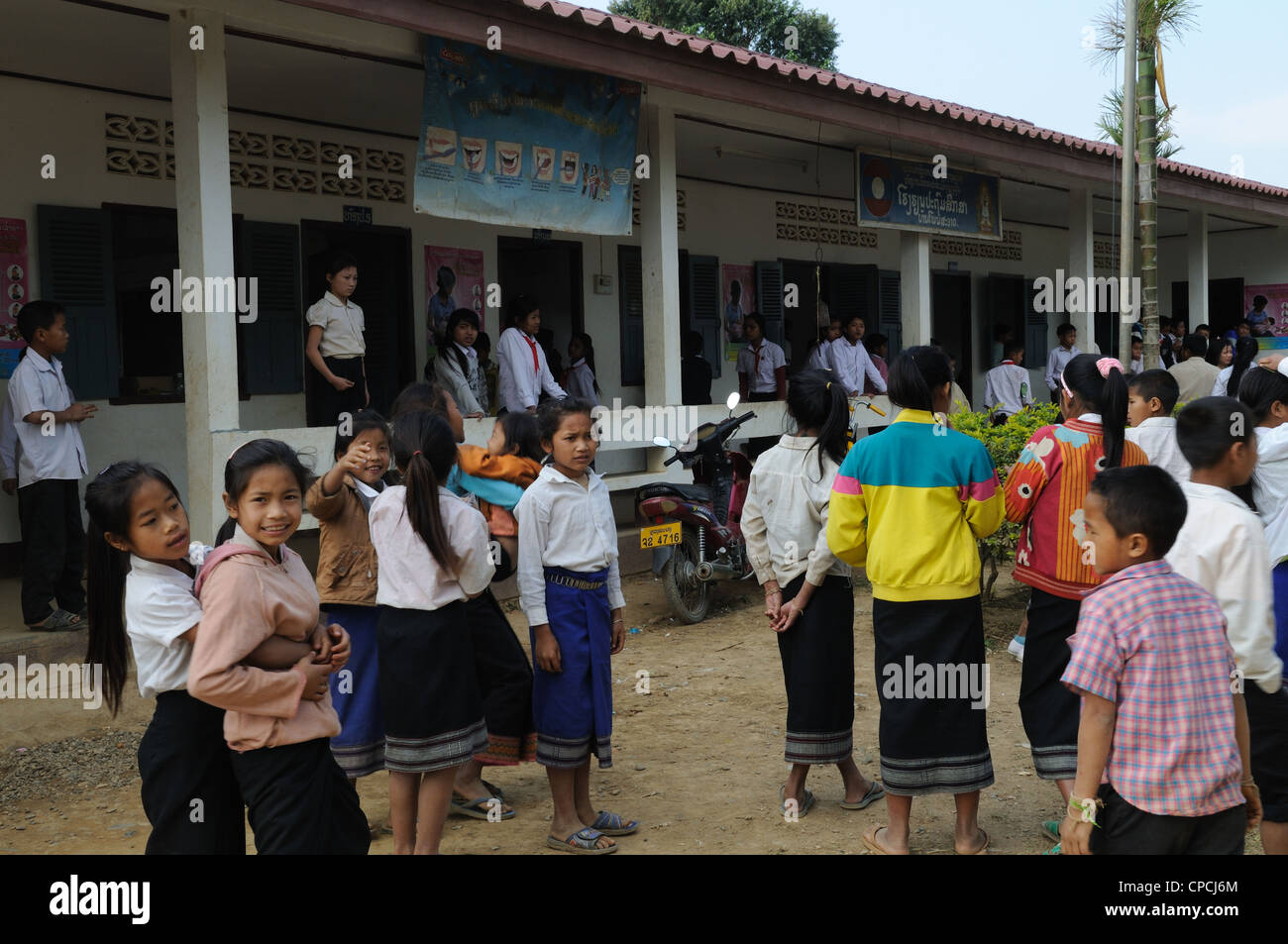 Lao school children during a presentation of books and stationary by ...