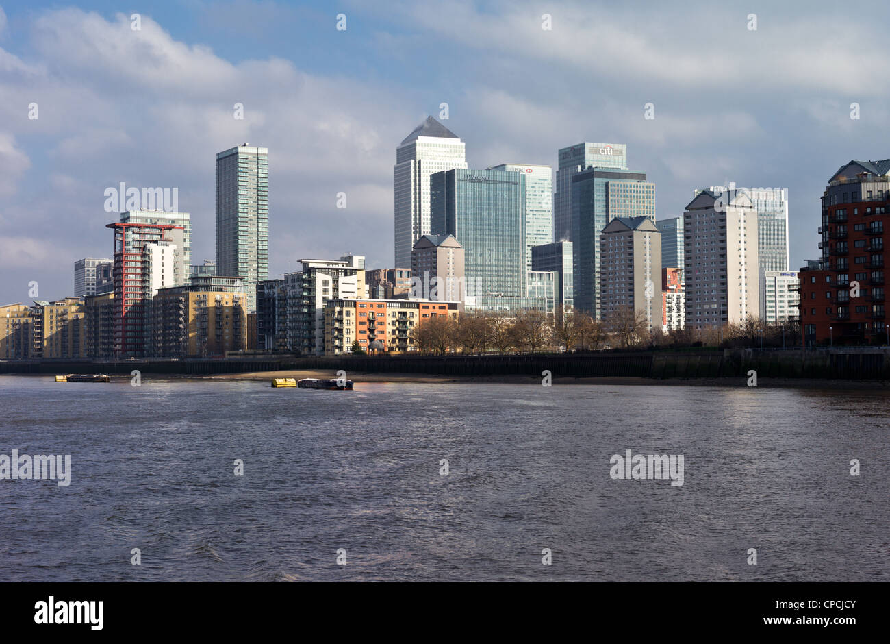 London seen from the Thames river, the Canary Wharf financial district ...