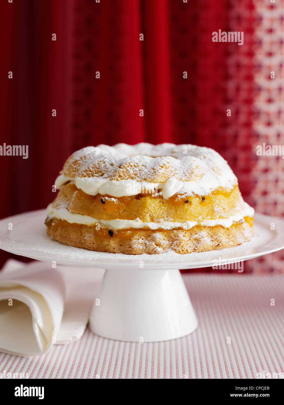 Platter of layered sponge cake Stock Photo - Alamy