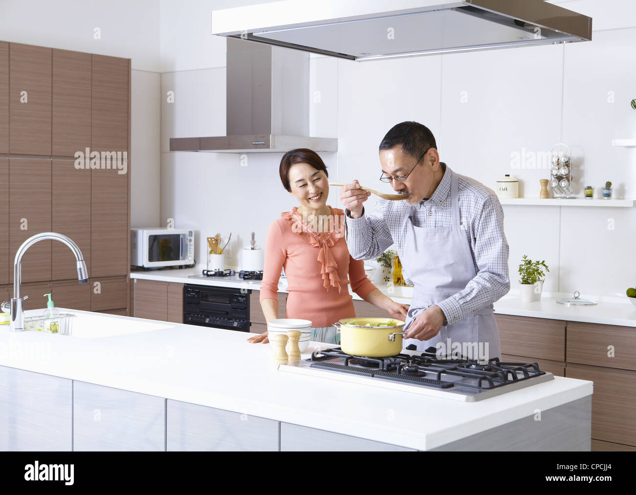 Senior couple enjoying cooking Stock Photo - Alamy