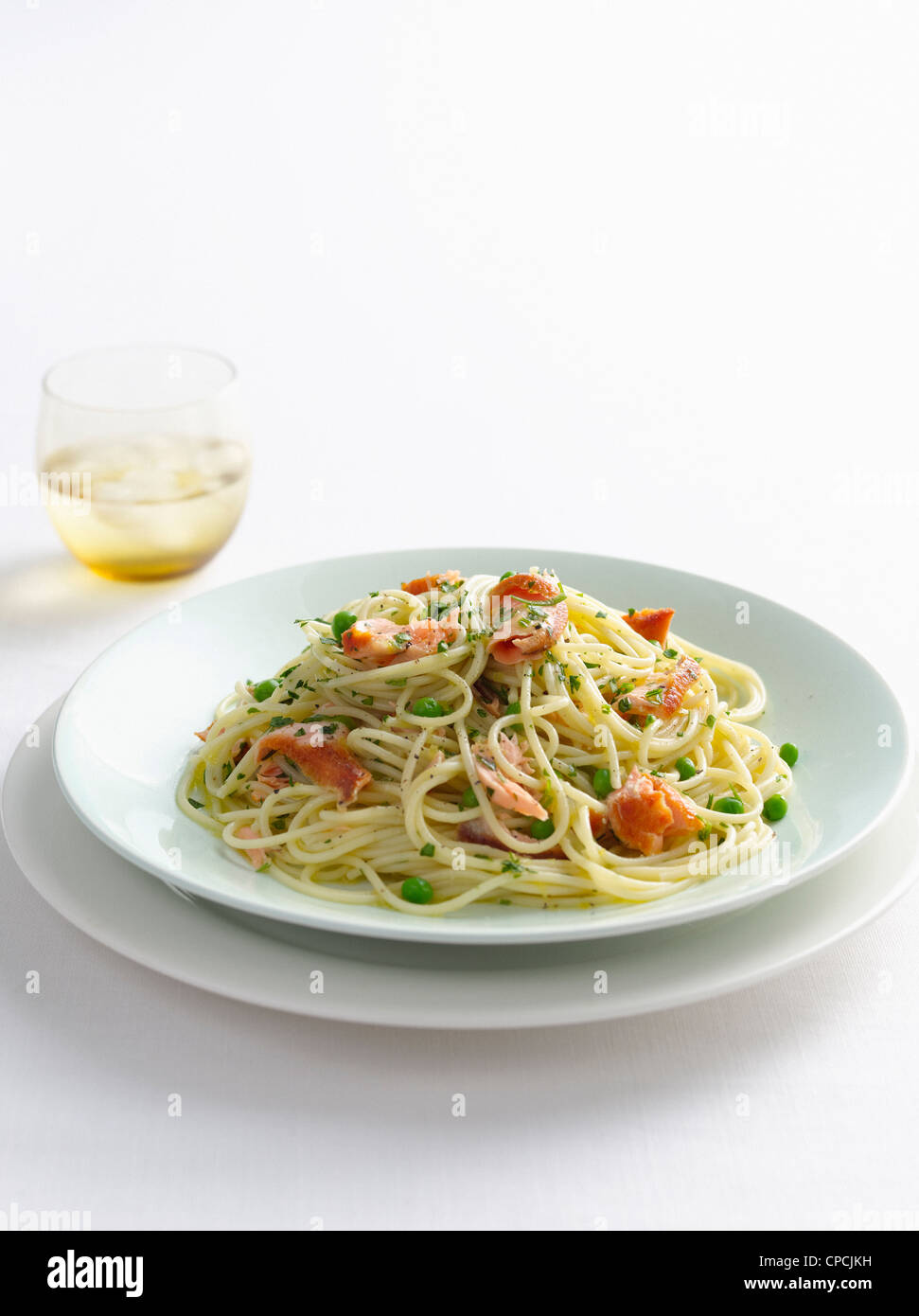 Plate of fish and pea pasta Stock Photo - Alamy