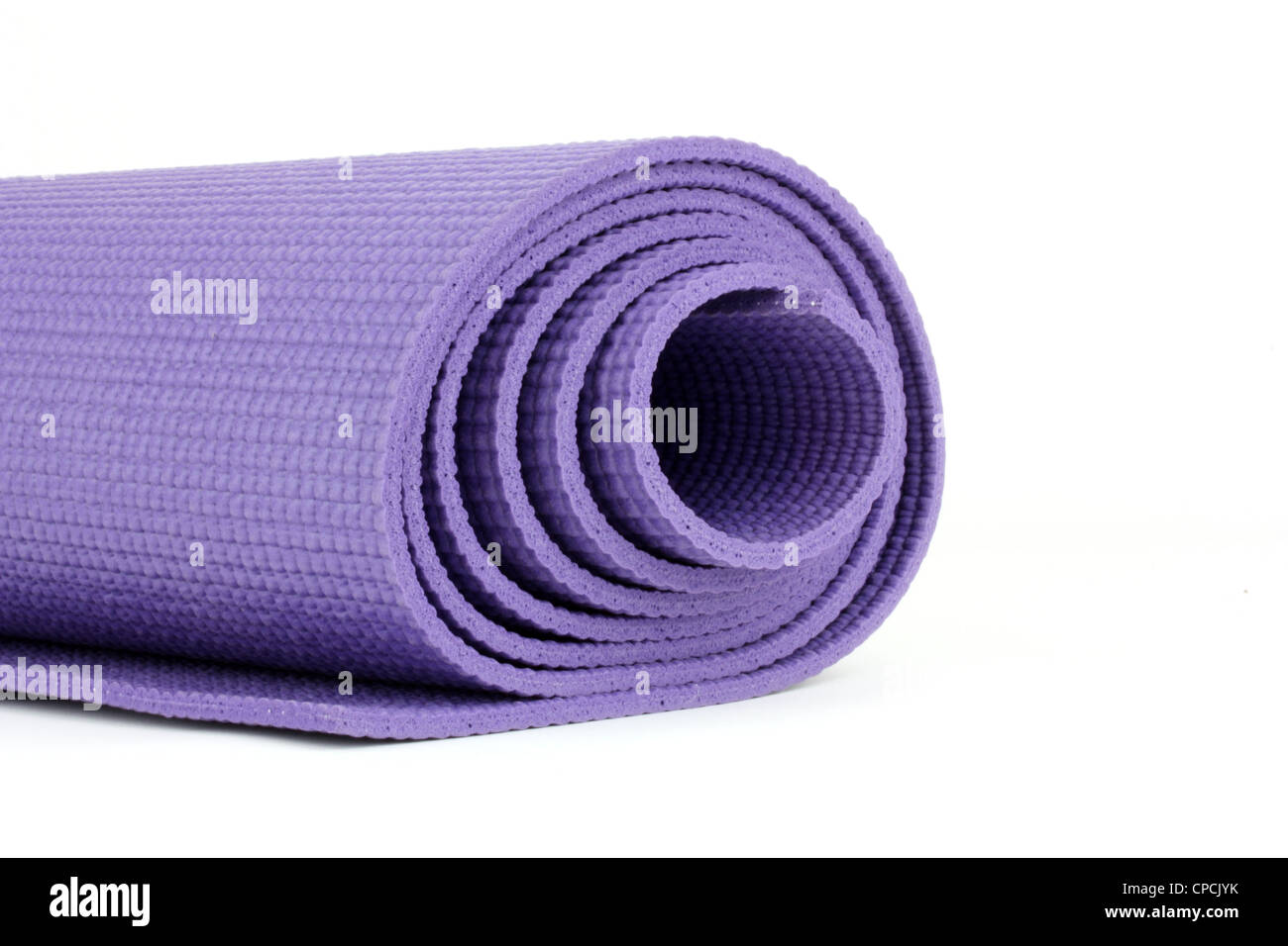 Purple Yoga Exercise Mat On White Background Stock Photo - Alamy