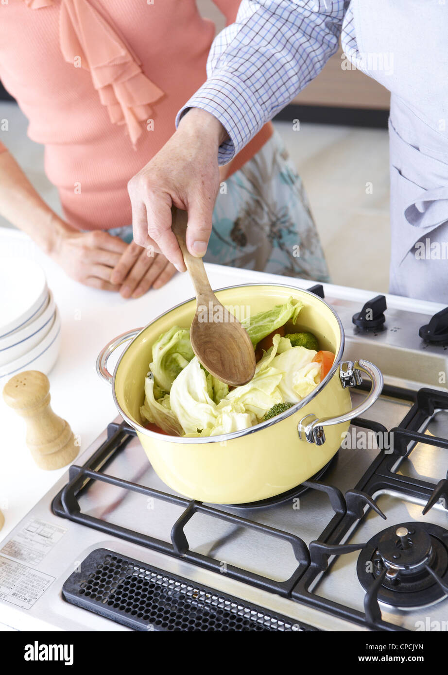 Cooking in a pot Stock Photo - Alamy