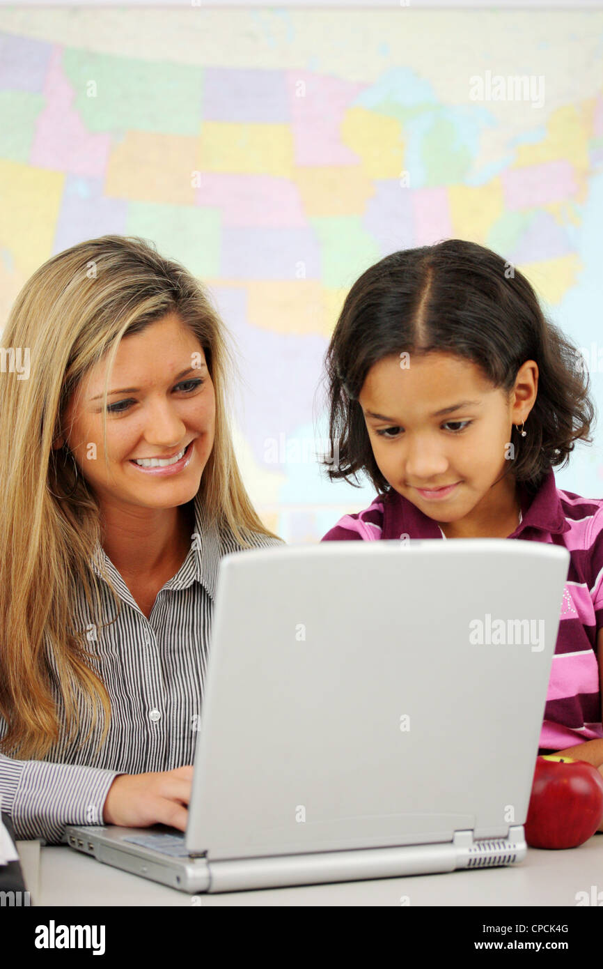 Teacher and Student In A Classroom At School Stock Photo - Alamy