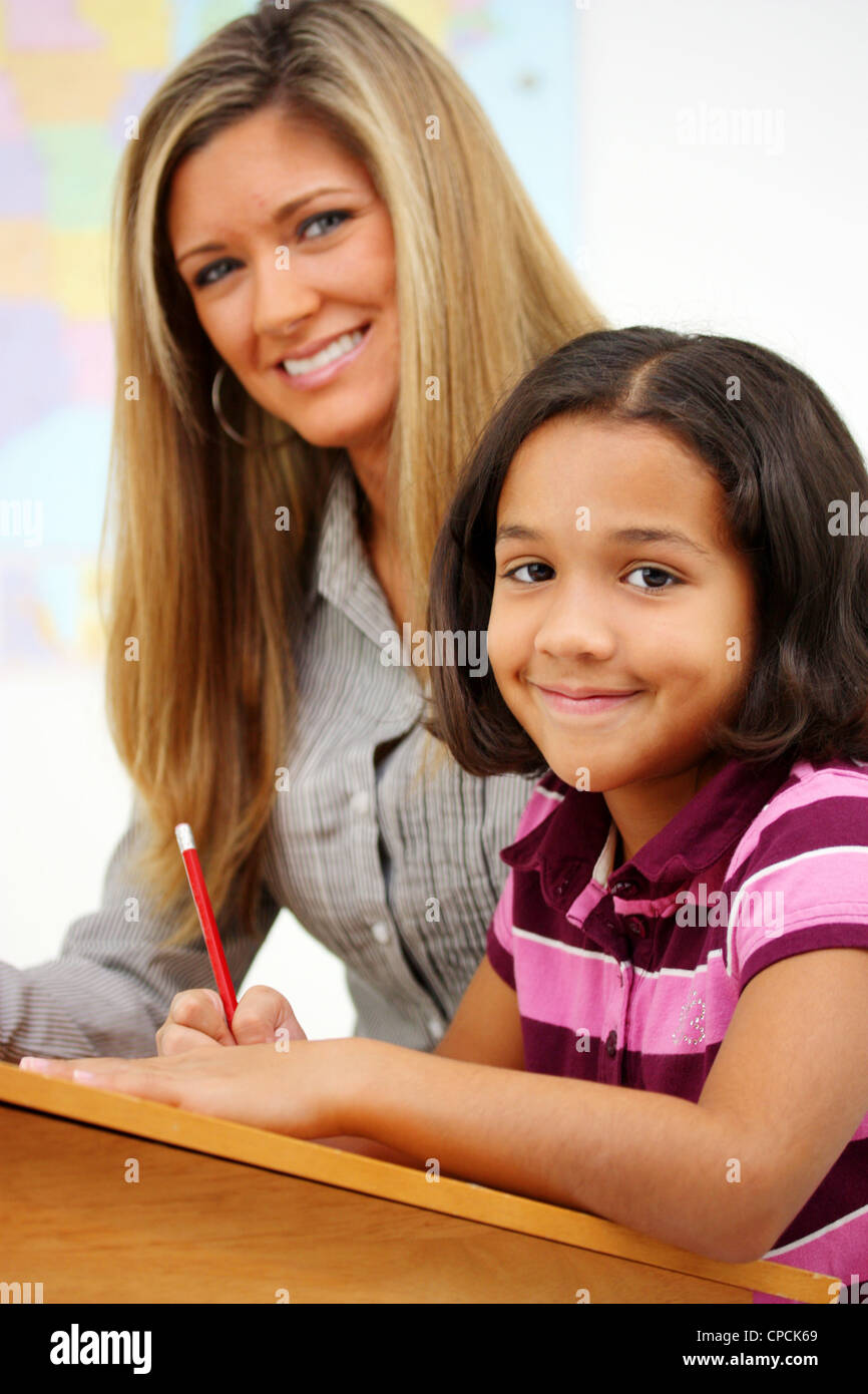 Teacher and Student In A Classroom At School Stock Photo - Alamy