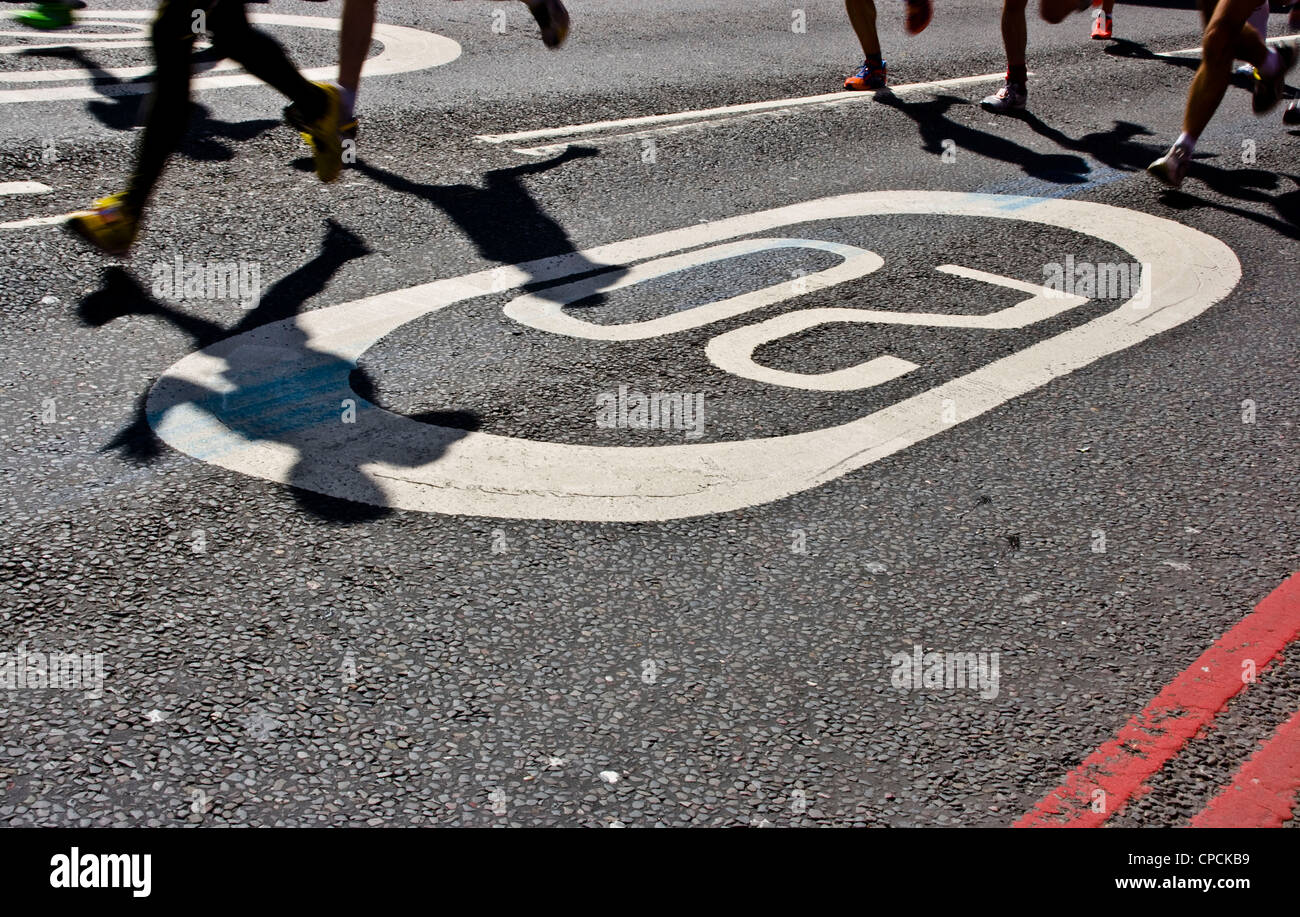 Marathon runners motion blur and shadows Stock Photo - Alamy