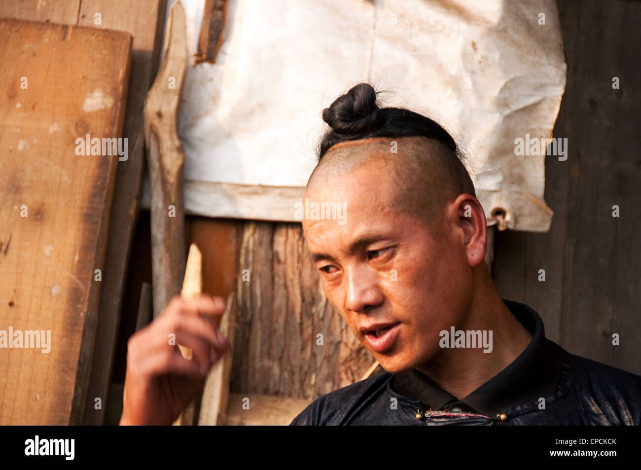 A young Basha Miao (Gun Men) with traditional hairstyle, Southern China ...