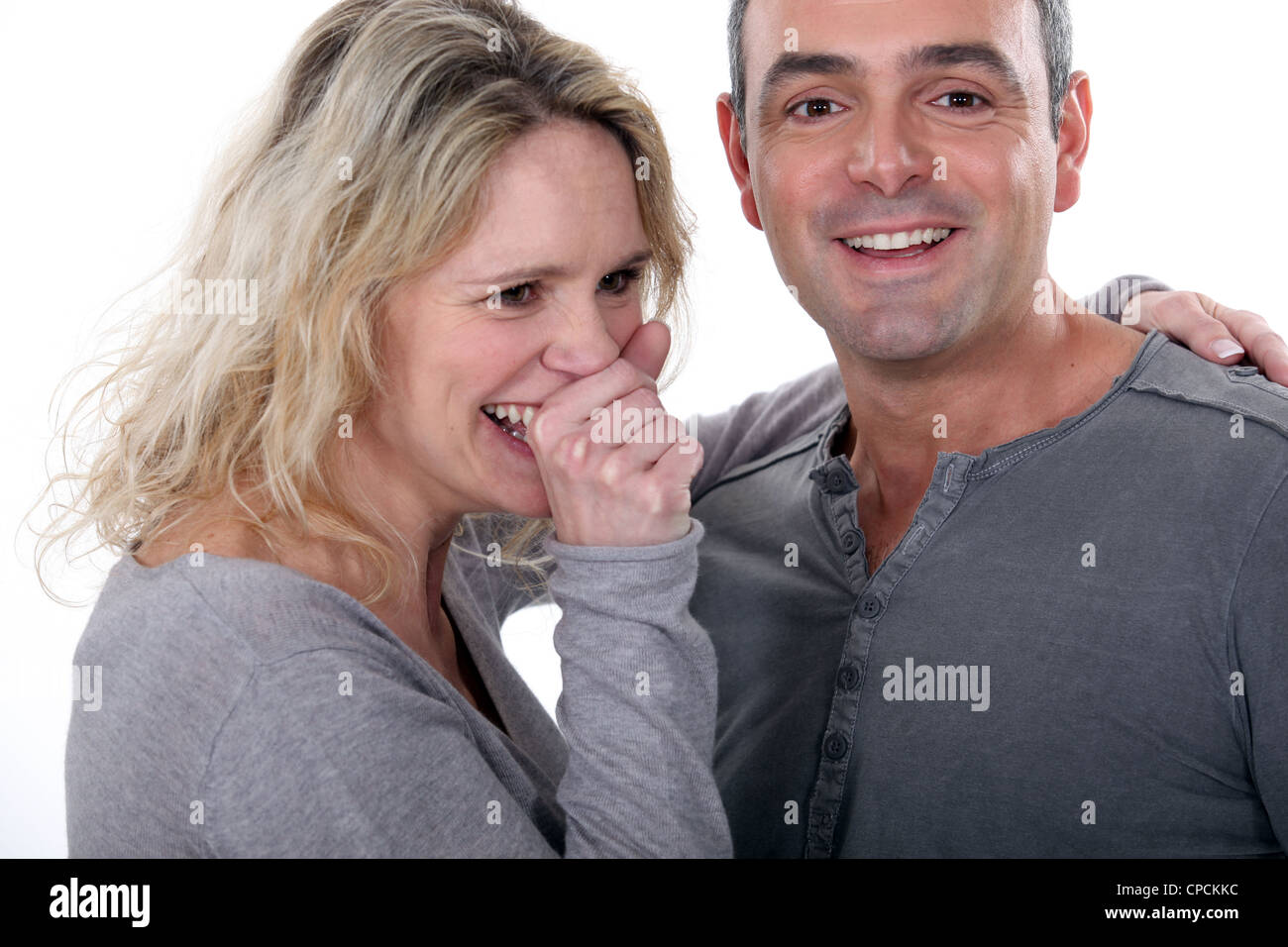 Loving couple in grey Stock Photo - Alamy