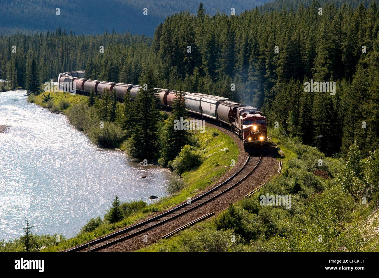 A Canadian Pacific train travelling through Morants Curve, near Lake Louise, Alberta, Canada ...