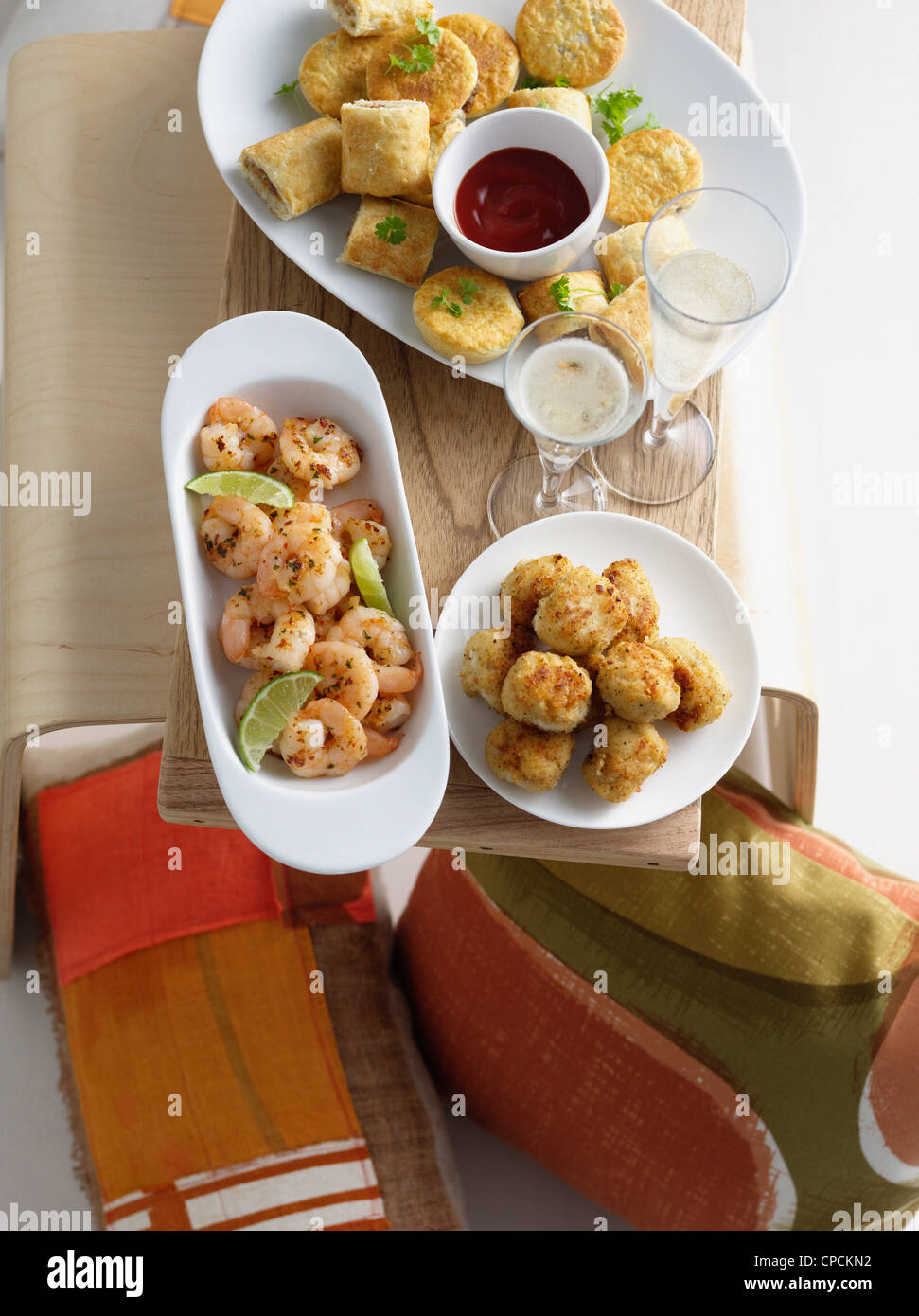 Dishes of prawns with biscuits Stock Photo - Alamy