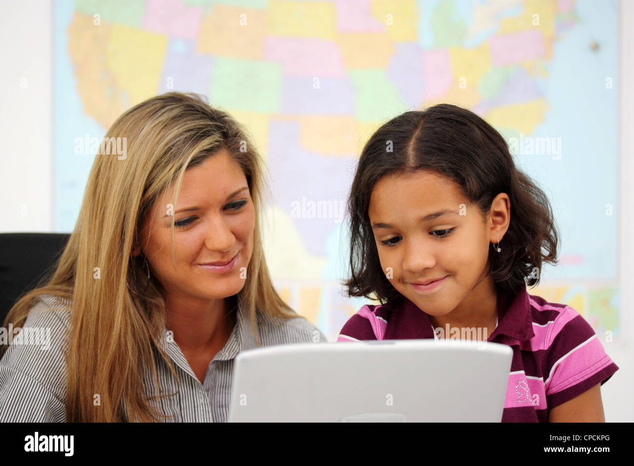 Teacher and Student In A Classroom At School Stock Photo - Alamy