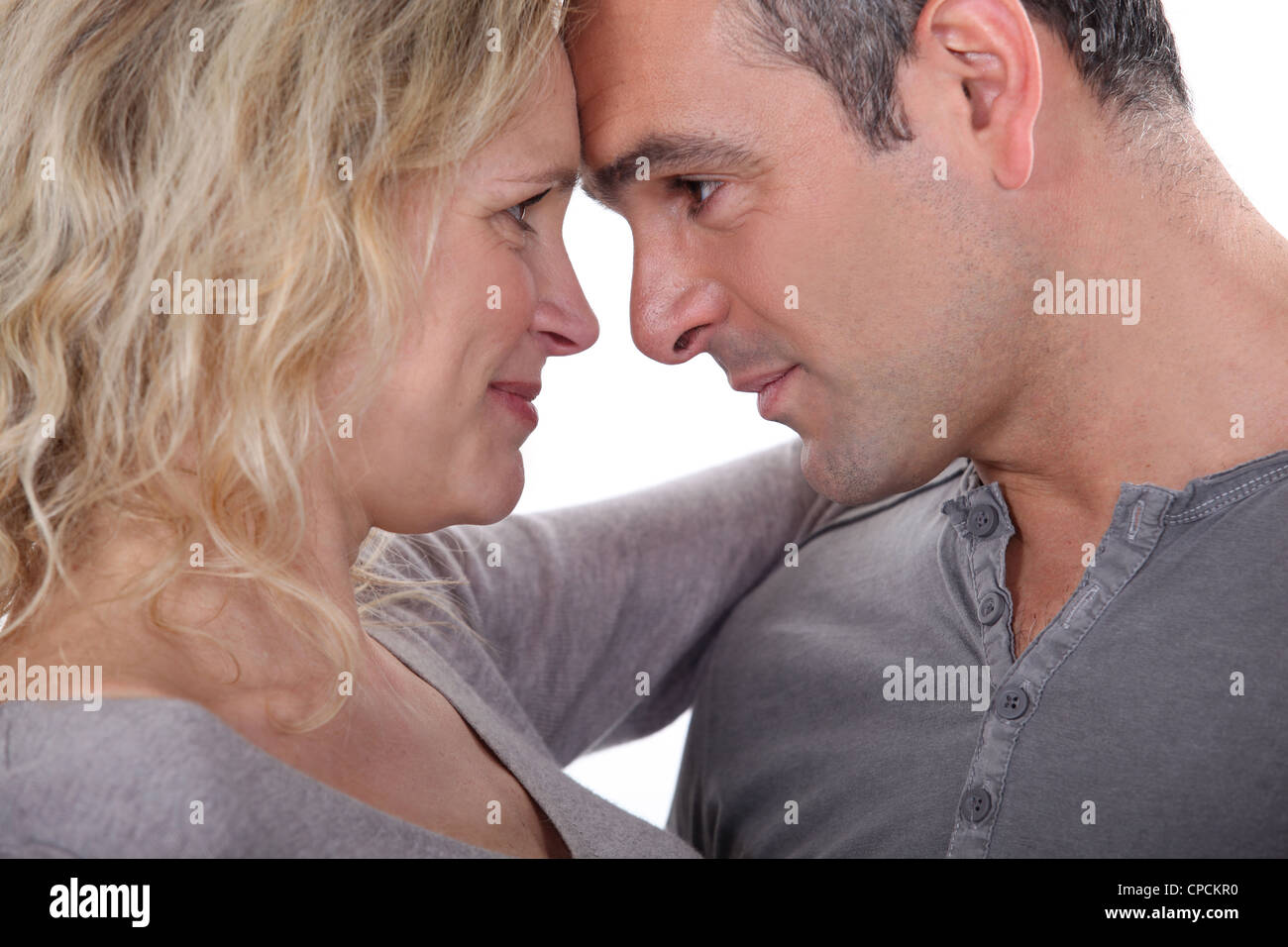 Couple facing each other Stock Photo - Alamy