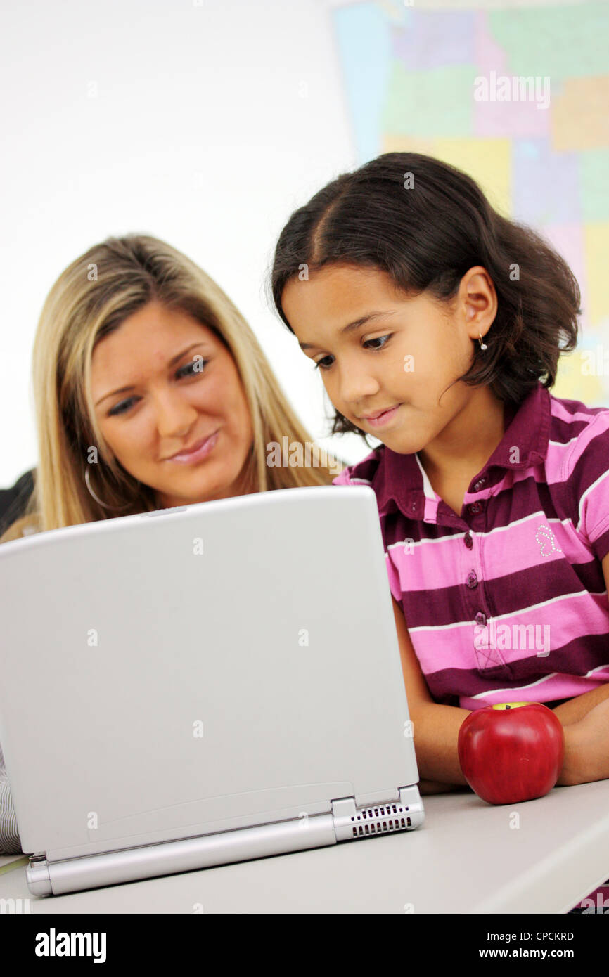 Teacher and Student In A Classroom At School Stock Photo - Alamy