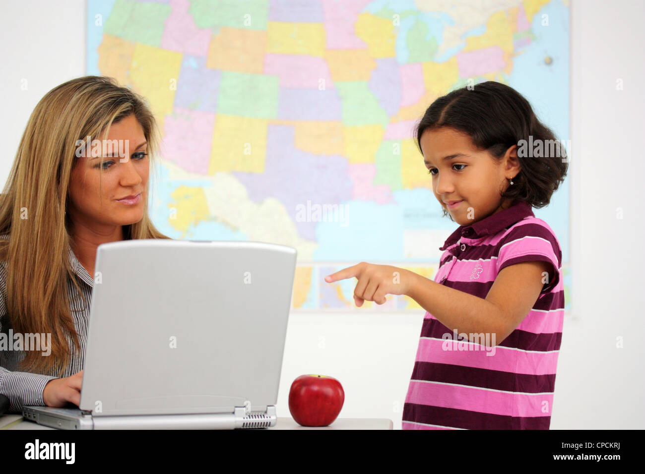 Teacher and Student In A Classroom At School Stock Photo - Alamy