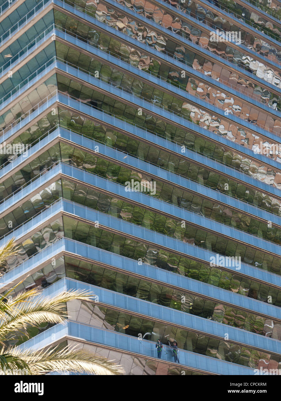 Window cleaning at a Barcelona seafront tower block Stock Photo - Alamy
