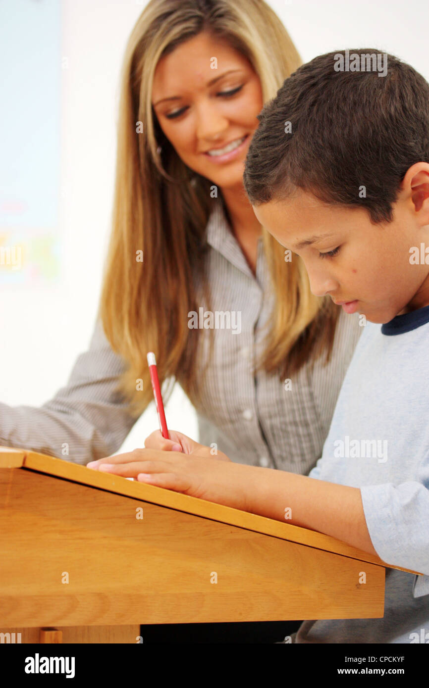 Teacher and Student In A Classroom At School Stock Photo - Alamy