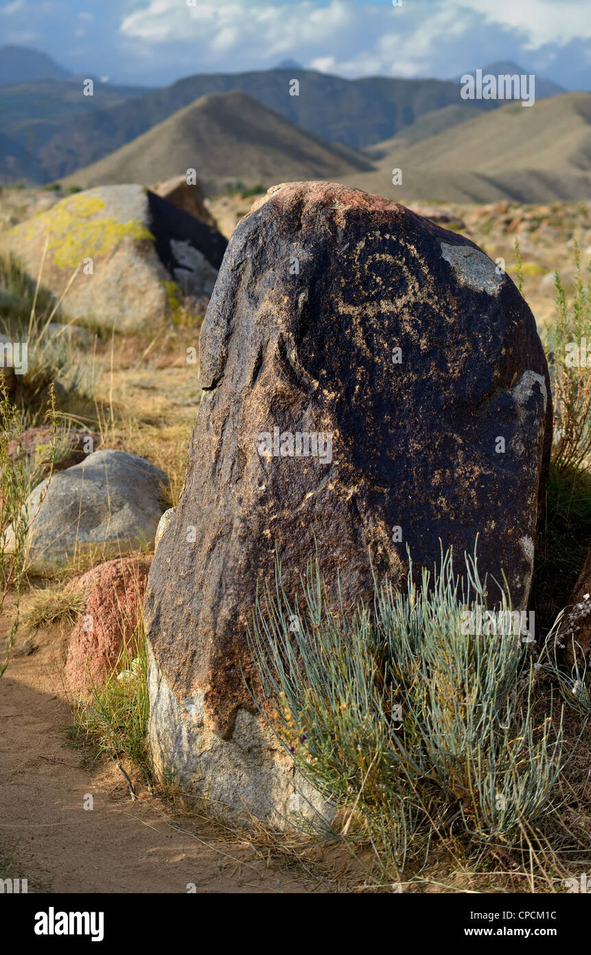 Rocks with petroglyph's during stone age in Kyrgyzstan Stock Photo - Alamy