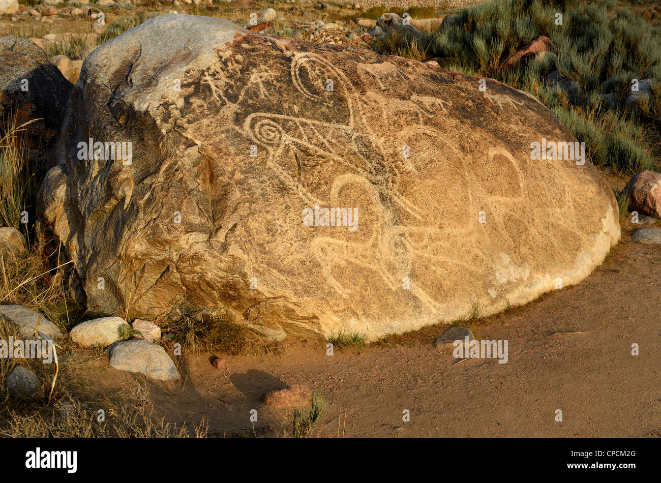 Rocks with petroglyph's during stone age in Kyrgyzstan Stock Photo - Alamy