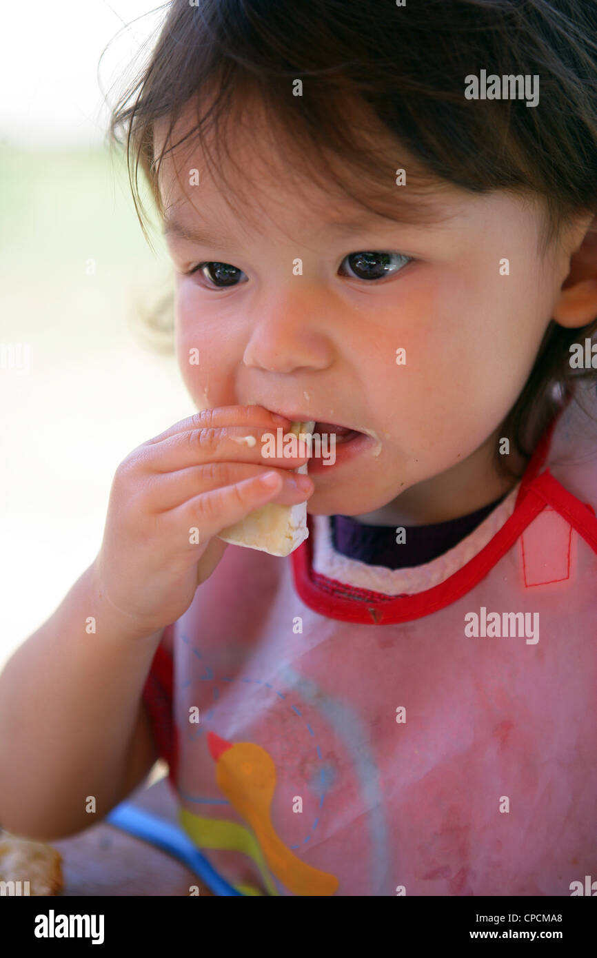 Little girl eating her lunch Stock Photo - Alamy