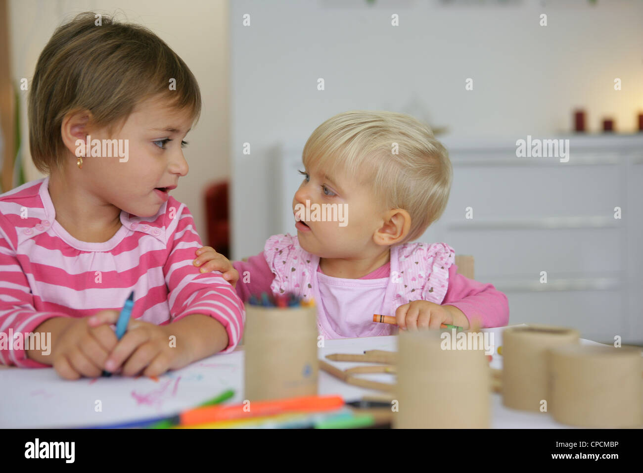 Child touching colored pencils hi-res stock photography and images - Alamy