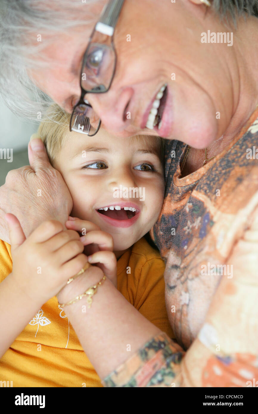 Woman hugging her grandchild Stock Photo - Alamy