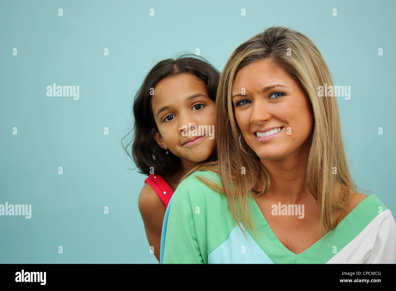 Family Sitting Together Outside In The Grass Stock Photo - Alamy