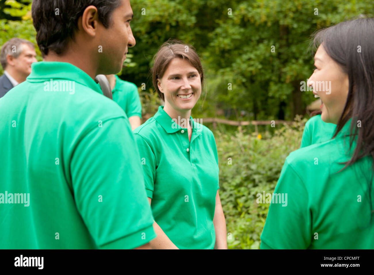 Gardeners talking in park Stock Photo - Alamy
