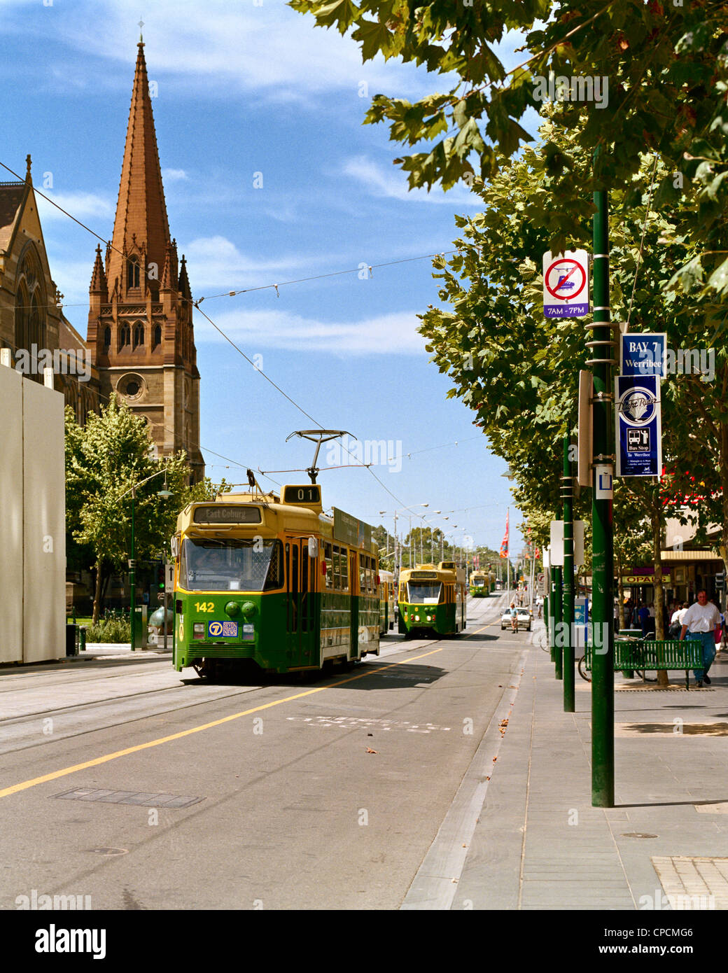 Green trams and St Paul's Cathedral Flinders Street Melbourne Australia ...