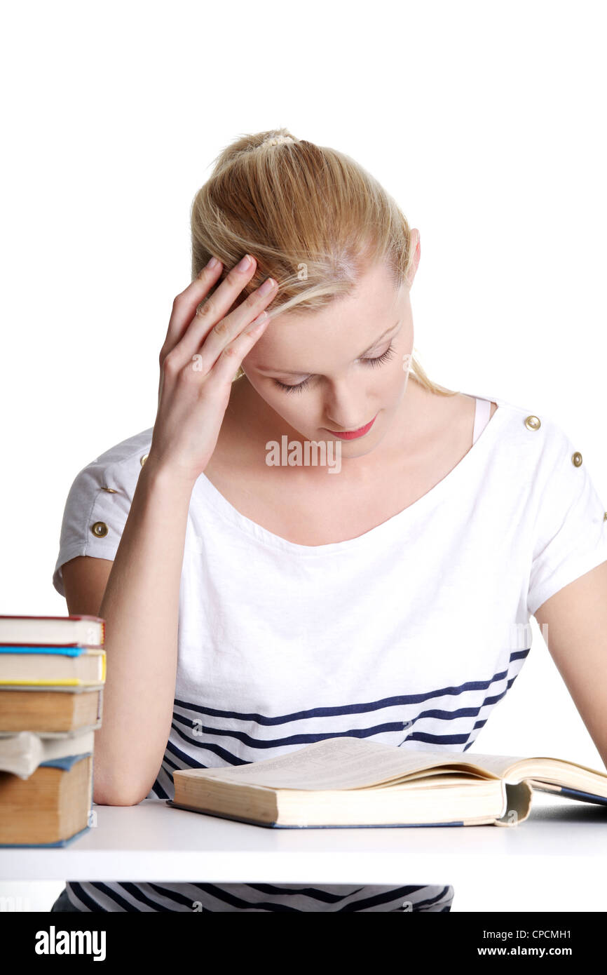 Young student woman with lots of books studying for exams Stock Photo ...