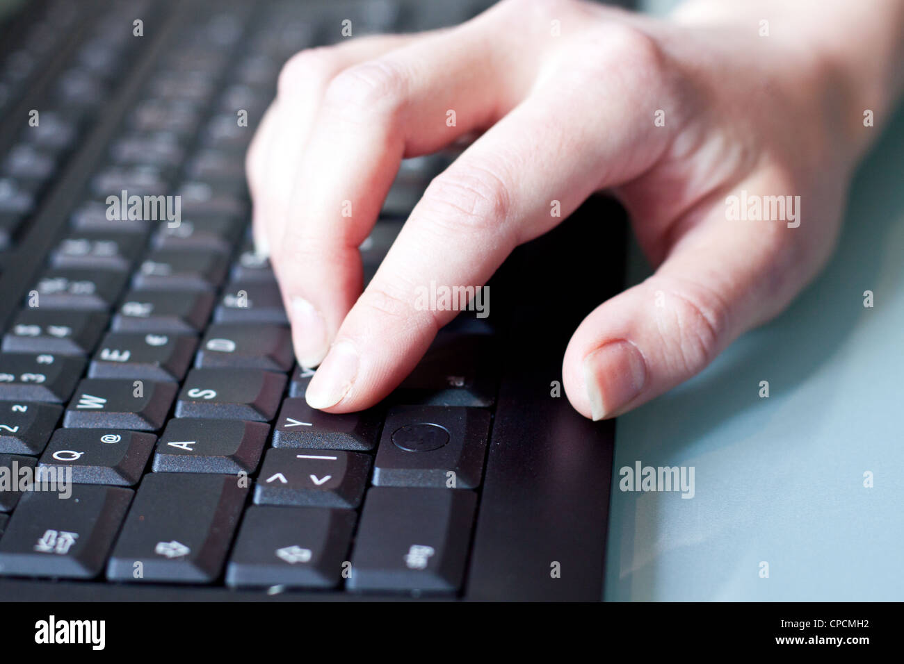 womans hand on a coumputer keyboard Stock Photo - Alamy