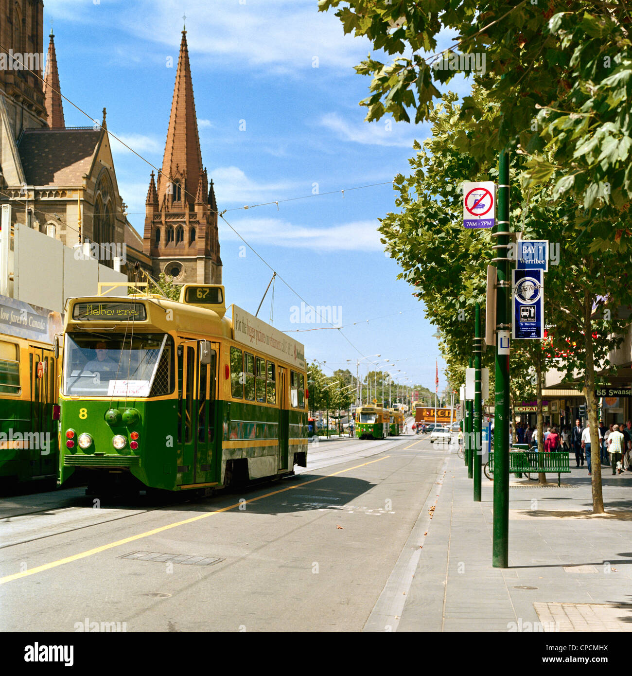Green trams and St Paul's Cathedral Flinders Street Melbourne Australia ...