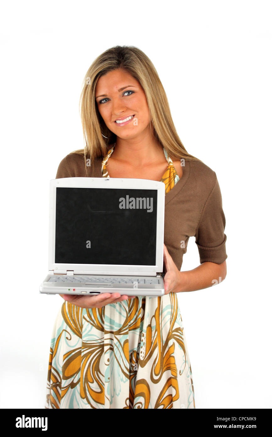 Happy young woman holding a computer for advertisement Stock Photo - Alamy