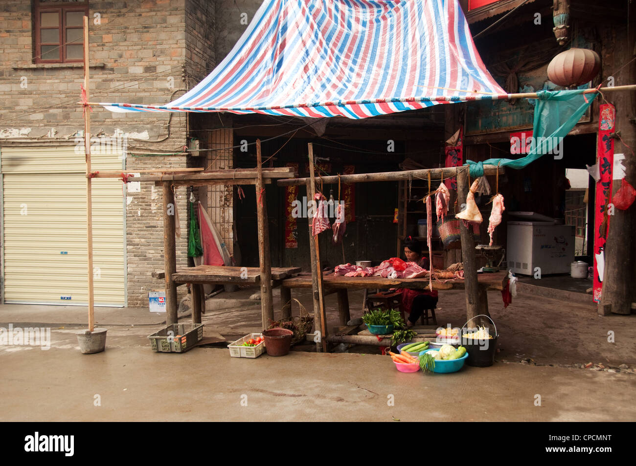 A typical butcher stall in a Dong people village, Southern China Stock ...