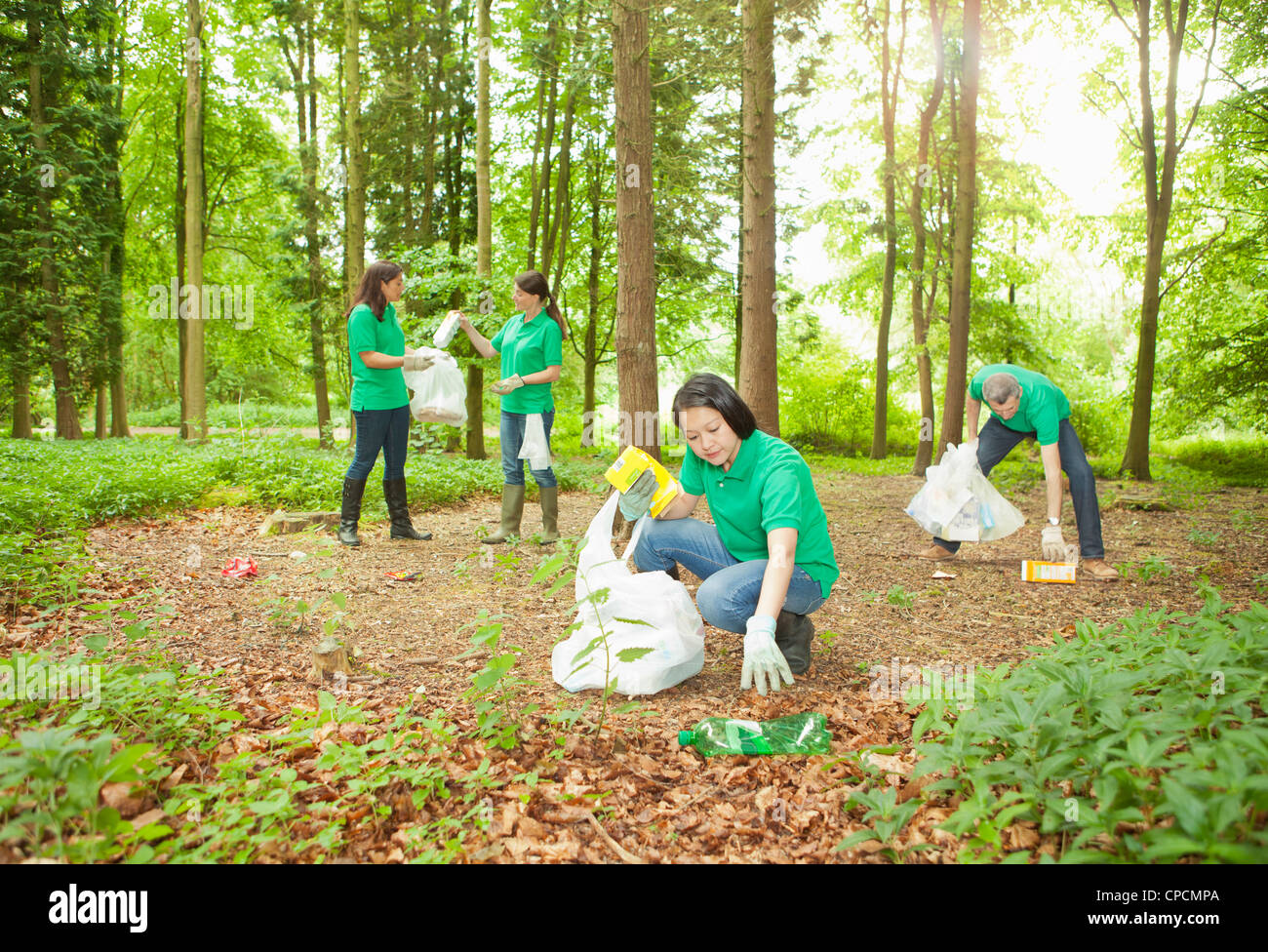 Gardeners picking up trash in park Stock Photo - Alamy