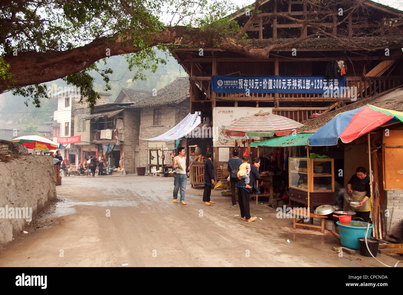 Busy street of a Dong people village, Southern China Stock Photo - Alamy