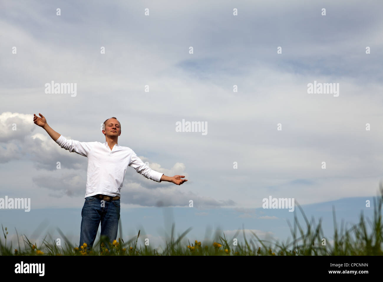 young man outdoor in summer in nature happy Stock Photo - Alamy