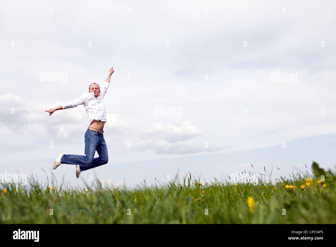 young man outdoor in summer in nature happy Stock Photo - Alamy
